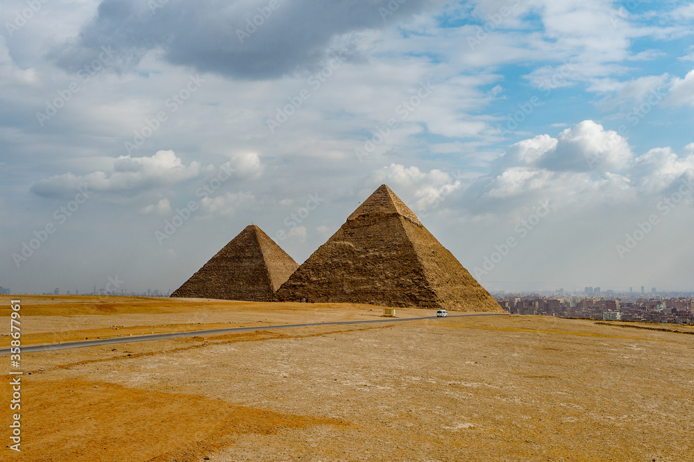 It's Pyramid of Khafre (Pyramid of Chephren) and Pyramid of Cheops ...