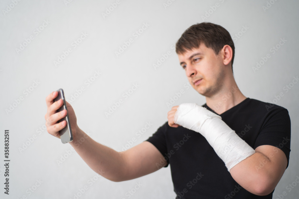Telemedicine. Broken arm. Patient with bone fracture communicates on ...