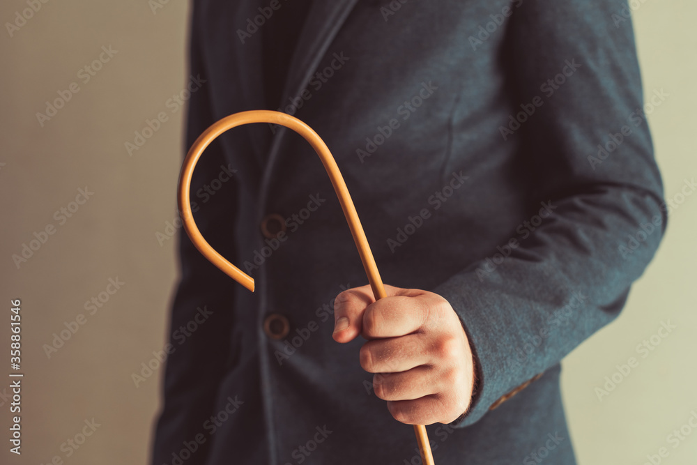 Headmaster with cane. Strict man teacher with crooked rattan cane ...