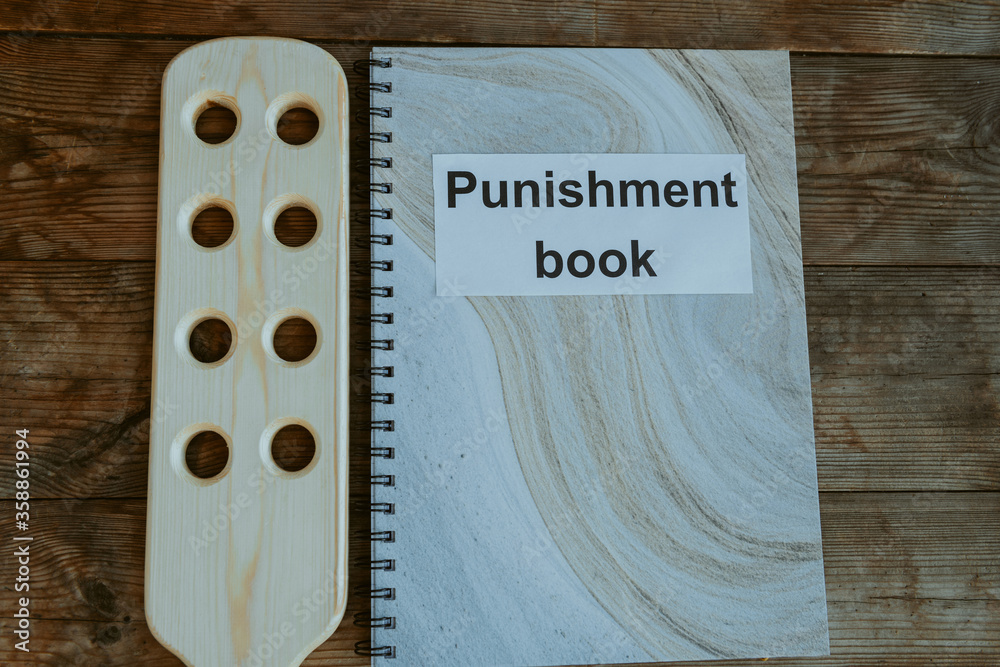 Punishment book. Wooden paddle for spanking on headmaster's or teacher ...