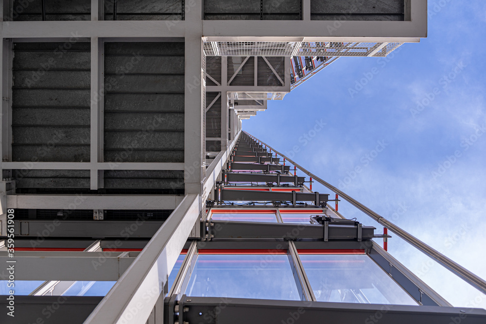 View through structural steel and glass work towards the blue sky on ...