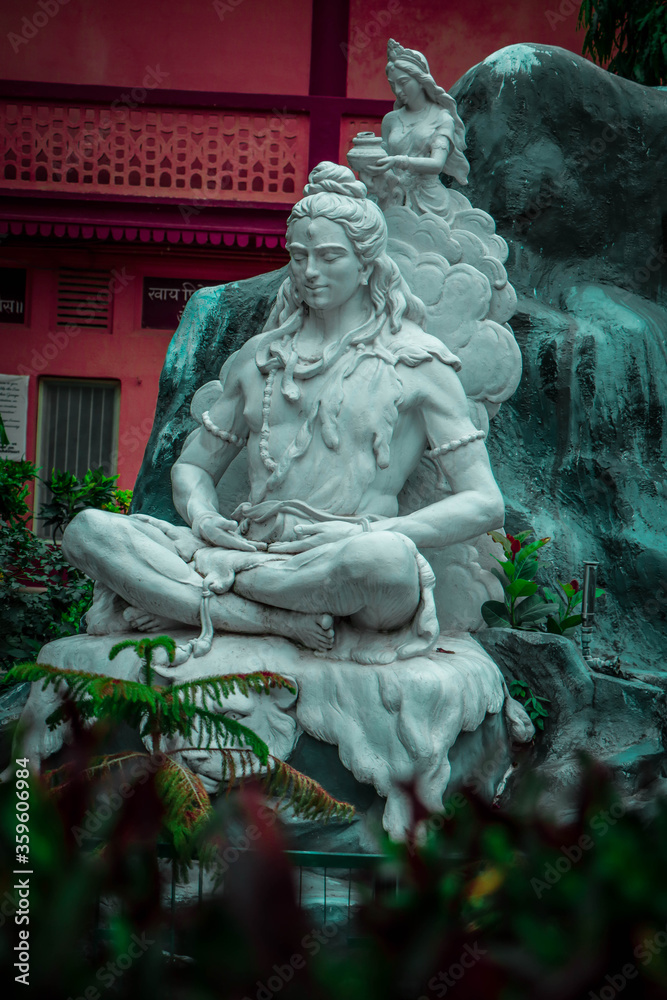 RISHIKESH, INDIA , Statue of Shiva, Hindu idol near Ganges River water ...