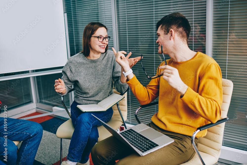 Positive hipster students dressed in casual wear arguing with each ...