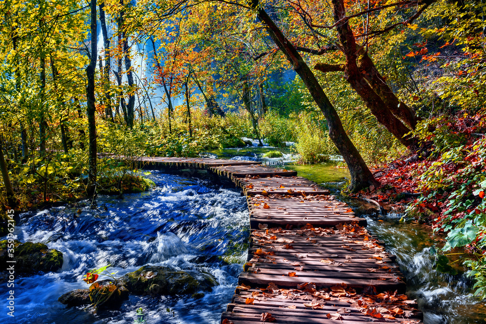 Croatia, Boardwalk stretching across stream flowing in PlitviceÔøΩLakes ...