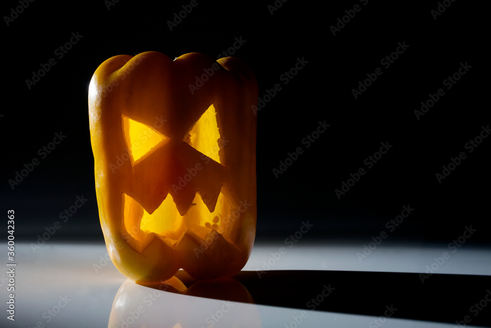 Food art creative concept. Halloween scary faces carved into green and ...