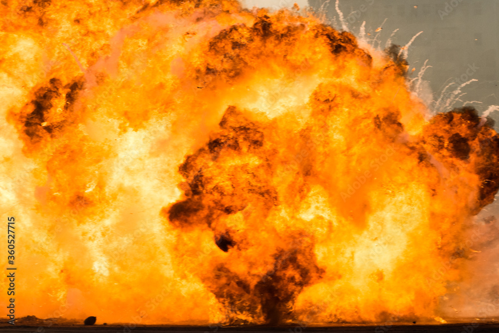 Photo Stock Massive orange fire explosion in military combat and war ...