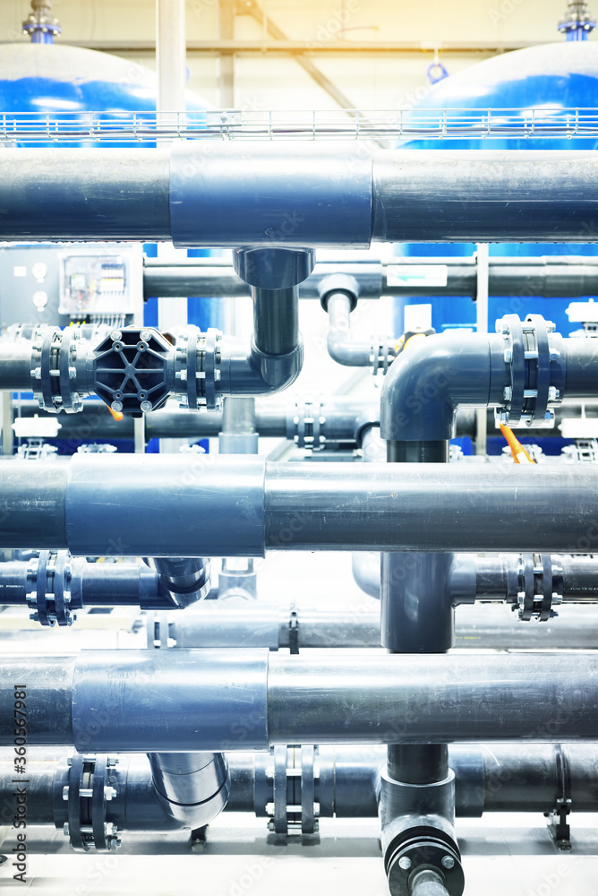 PVC pipeline an industrial city water treatment boiler room. Valves and ...