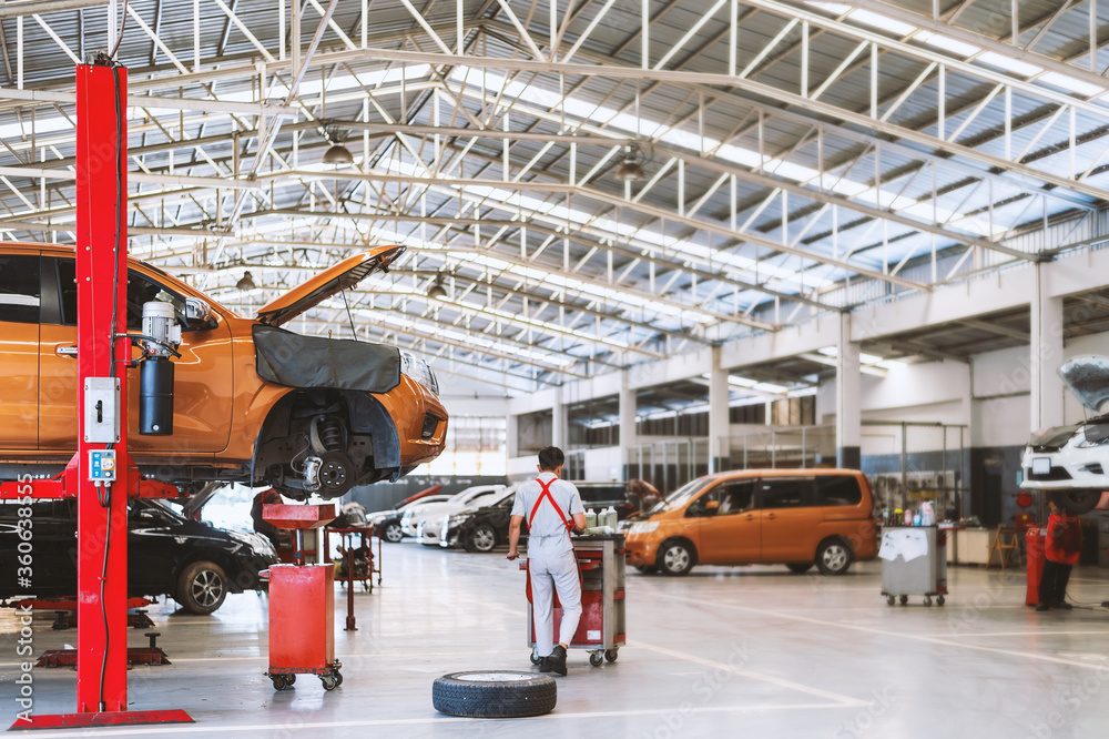 Interior of a car repair in garage service station with soft-focus and ...