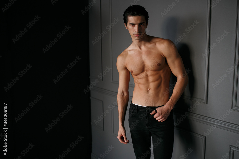 Horizontal view. Profile portrait of a young man with shirtless torso ...
