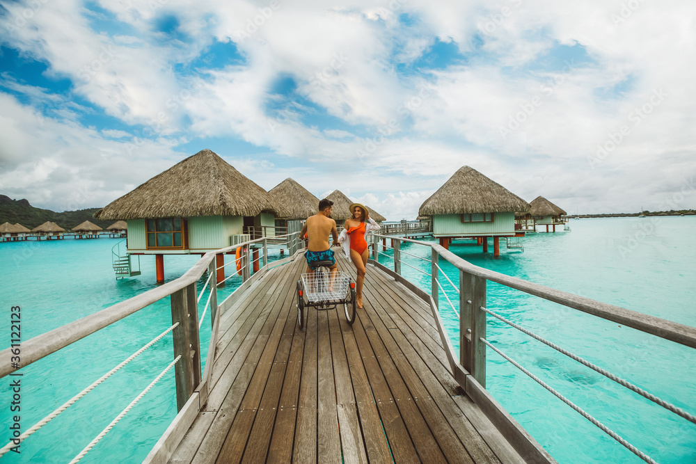 in love couple posing on dock near tropical resort Stock Photo | Adobe ...