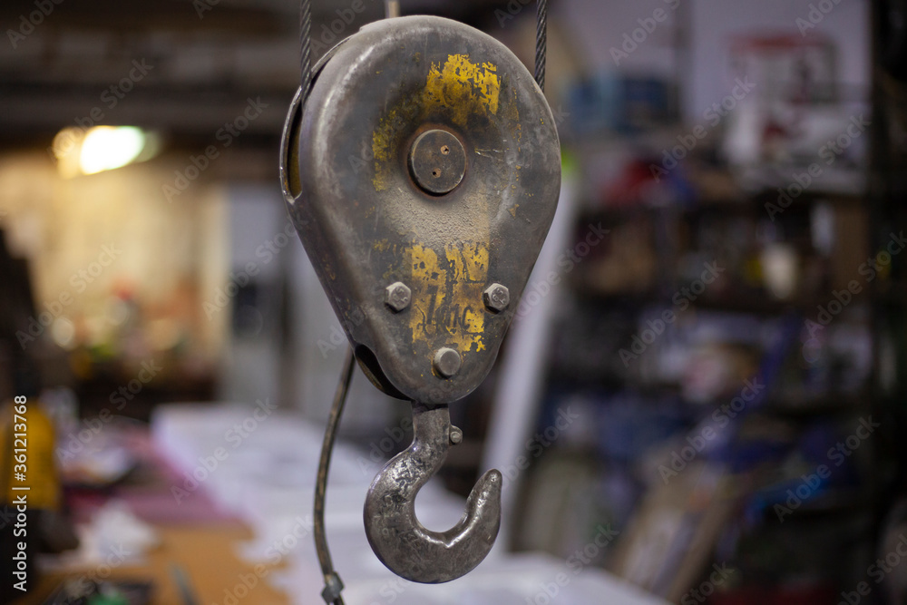 Cargo hook hanging on the ropes. Stock Photo | Adobe Stock