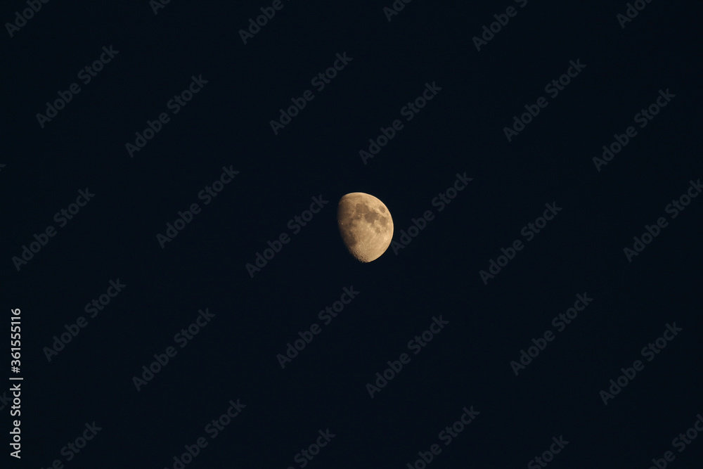 Color photo of the growing big moon at perigee on a black background ...