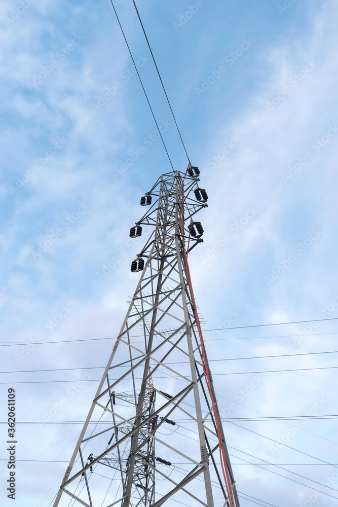 High voltage power transmission tower. Power tower with cloud ...