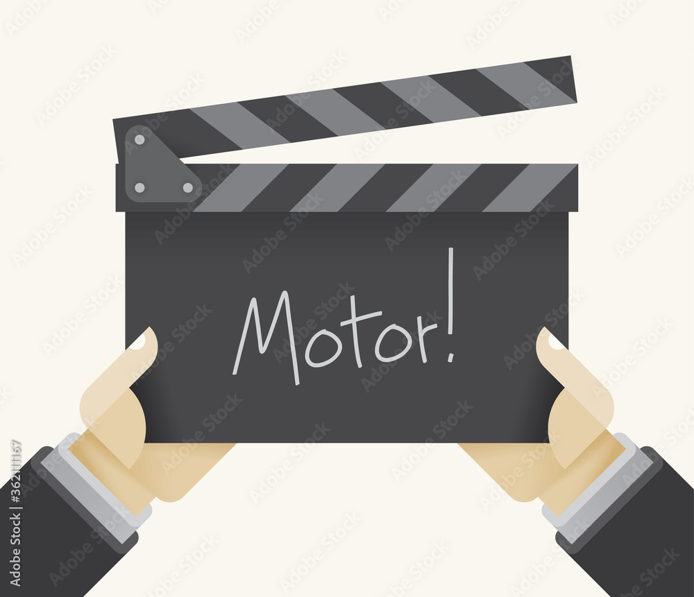 Movie clapperboard with Motor! text in director's hands. Idea ...