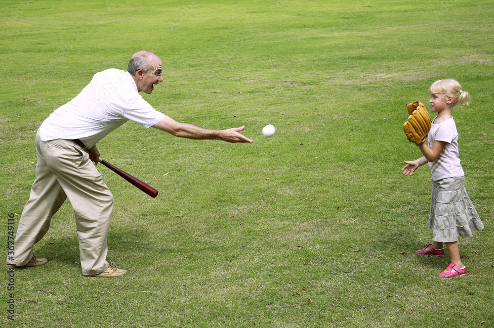 Father and daughter playing baseball Stock Photo | Adobe Stock