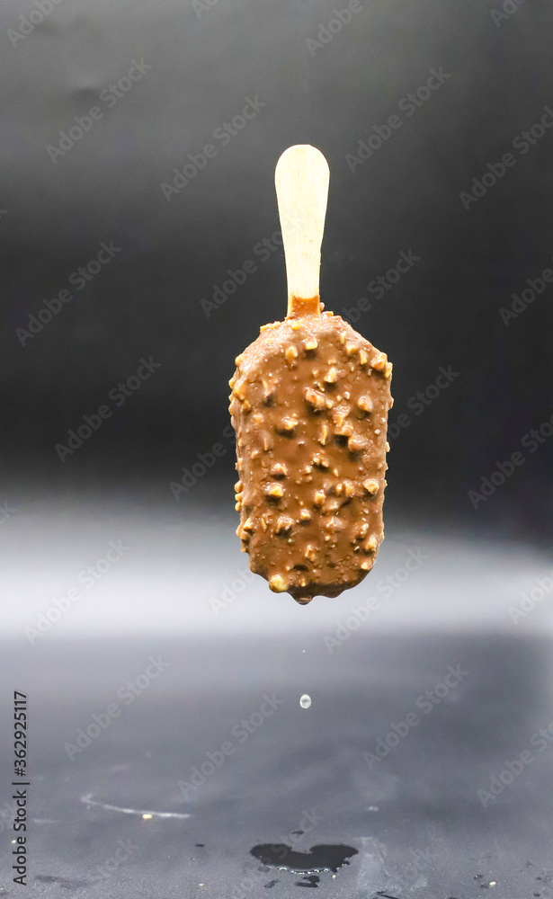 Dropping water from the ice cream bar with center focus. Chocolate ...