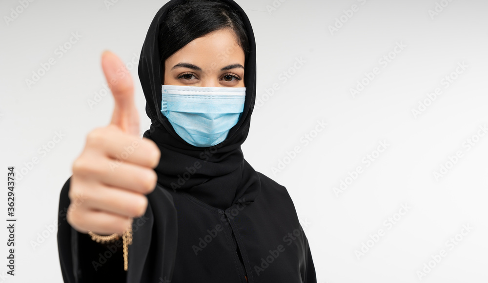 Beautiful Arab young woman with disposable face mask. Protection versus ...