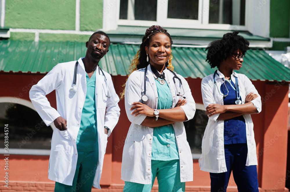 Three African American group doctors with stethoscope wearing lab coat ...