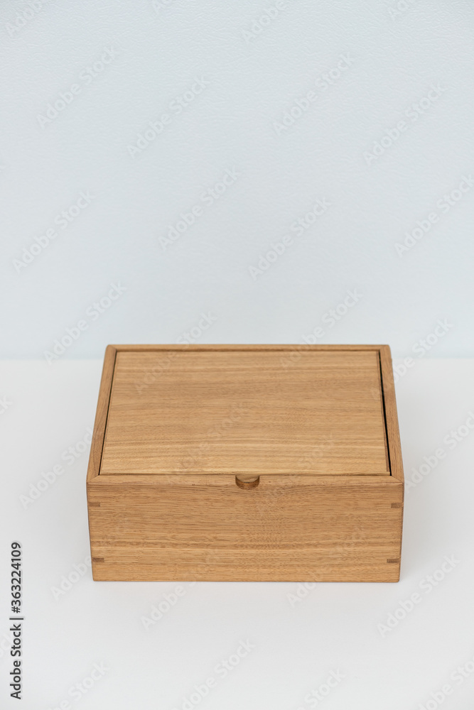 Large wooden box with a separator on a light mint background empty ...