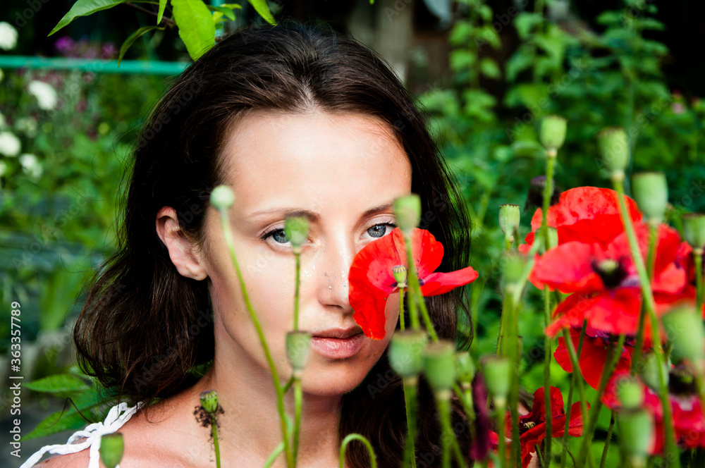 sexy girl with poppy seed flowers. beauty and perfection. summer flower ...
