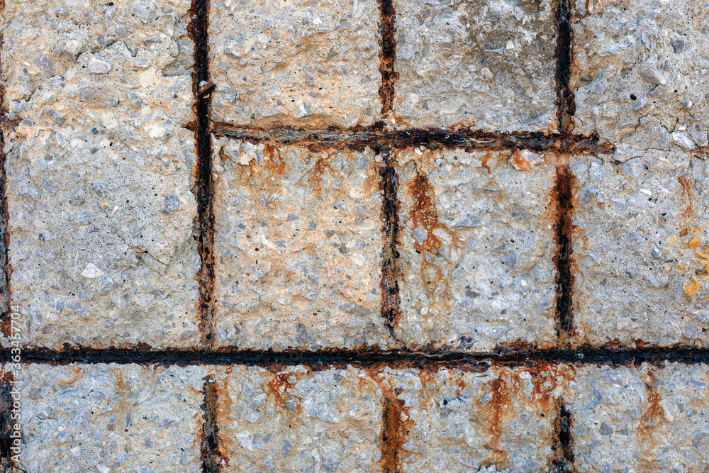 Degraded concrete and rusted, exposed rebars or bars. The expansion of ...