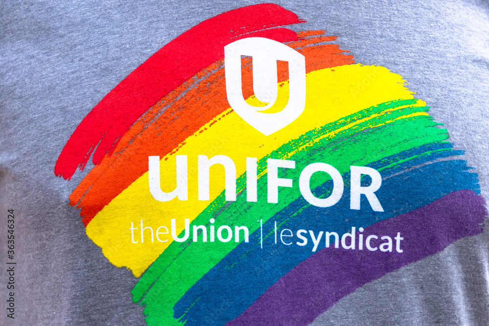 Logo of the Unifor Union over a rainbow flag Stock Photo | Adobe Stock