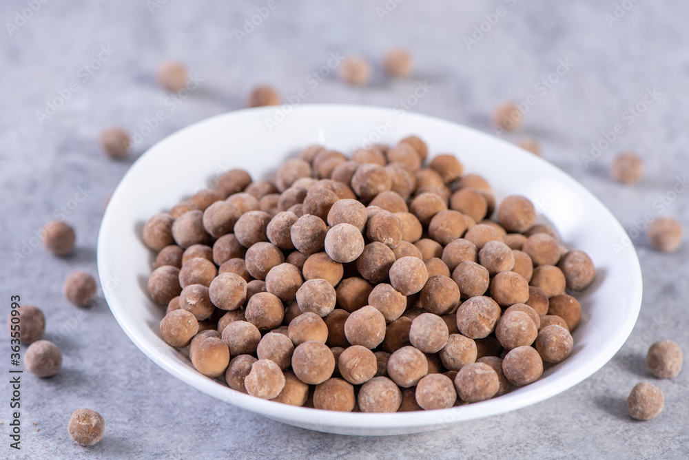 Dry raw brown tapioca pearls isolated on gray cement concrete ...
