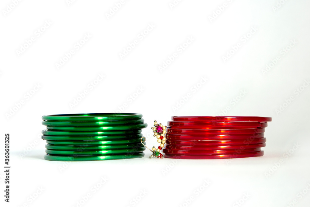 Stacked upon each other green bangles in front of bangales ...