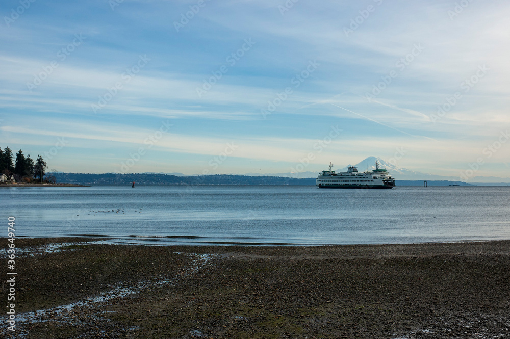 Ferry in Puget Sound against the backdrop of Mount Rainier, with blue ...