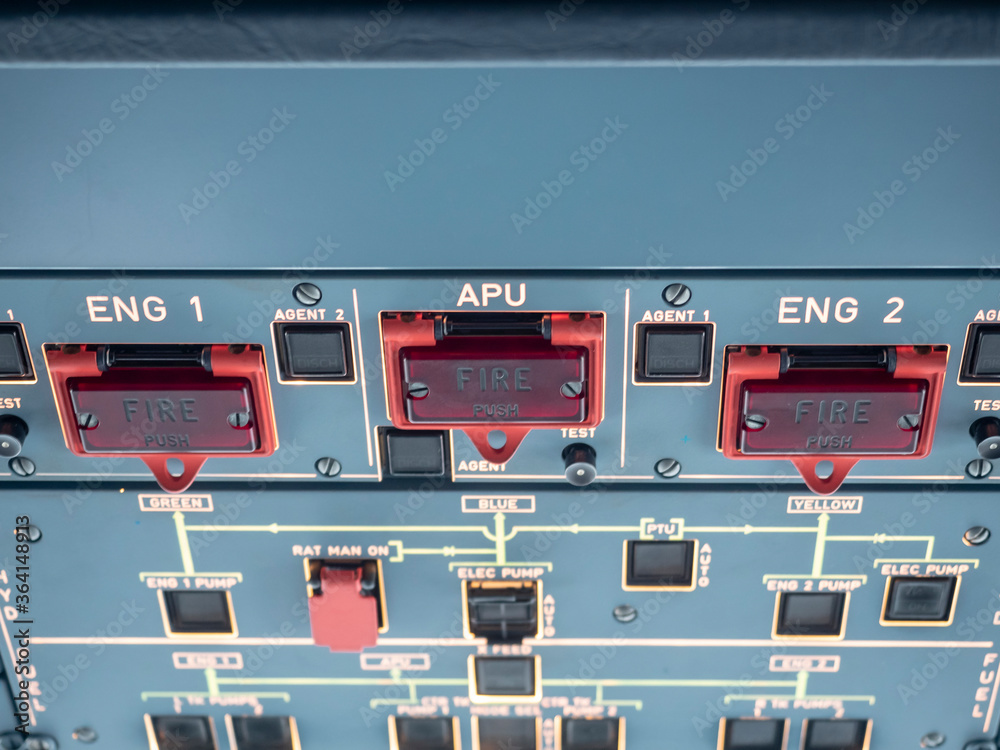 Fire push button and warning lights on the overhead panel in an A320 ...