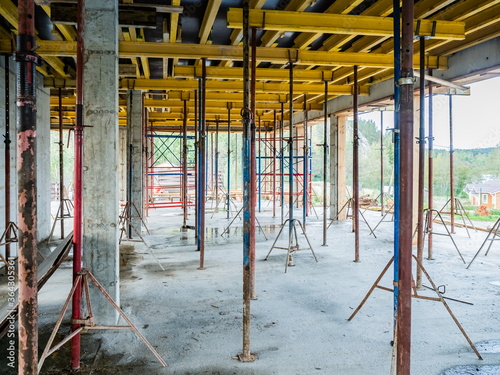 Construction site. Supports support the roof of the building. Metal ...