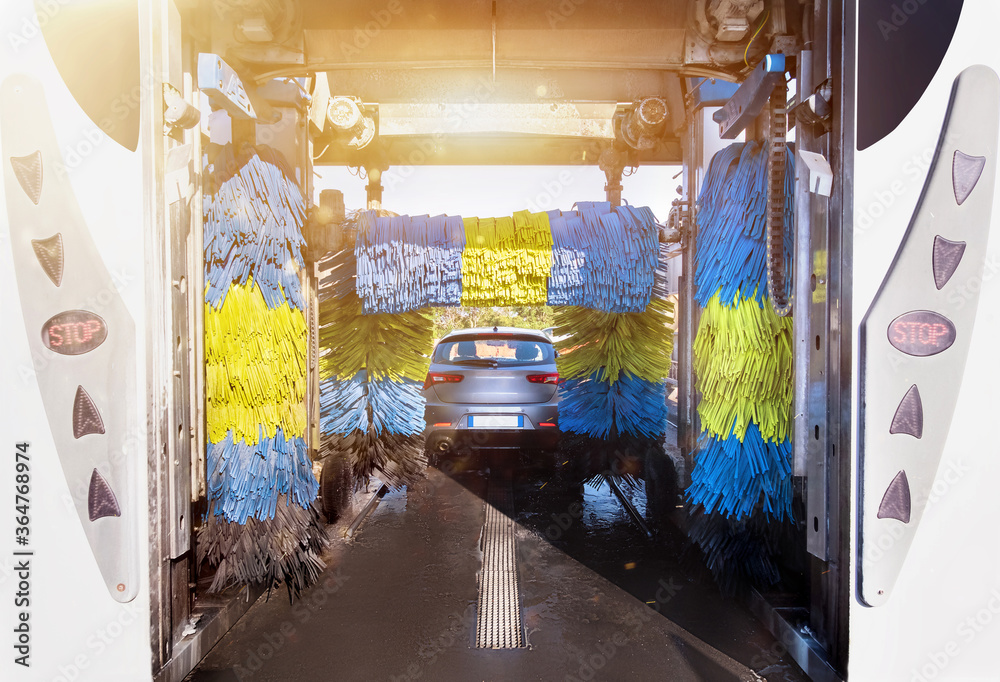 Foto de Stock Automatic car washing station with vehicle inside and ...