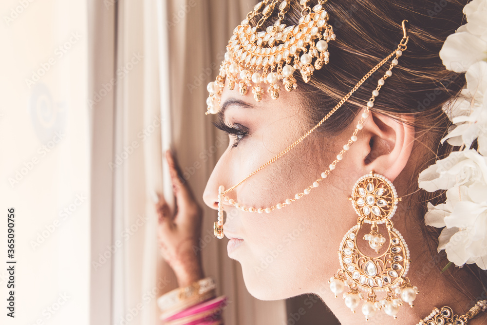 Beautiful female model wearing traditional Sikh wedding attire as she ...