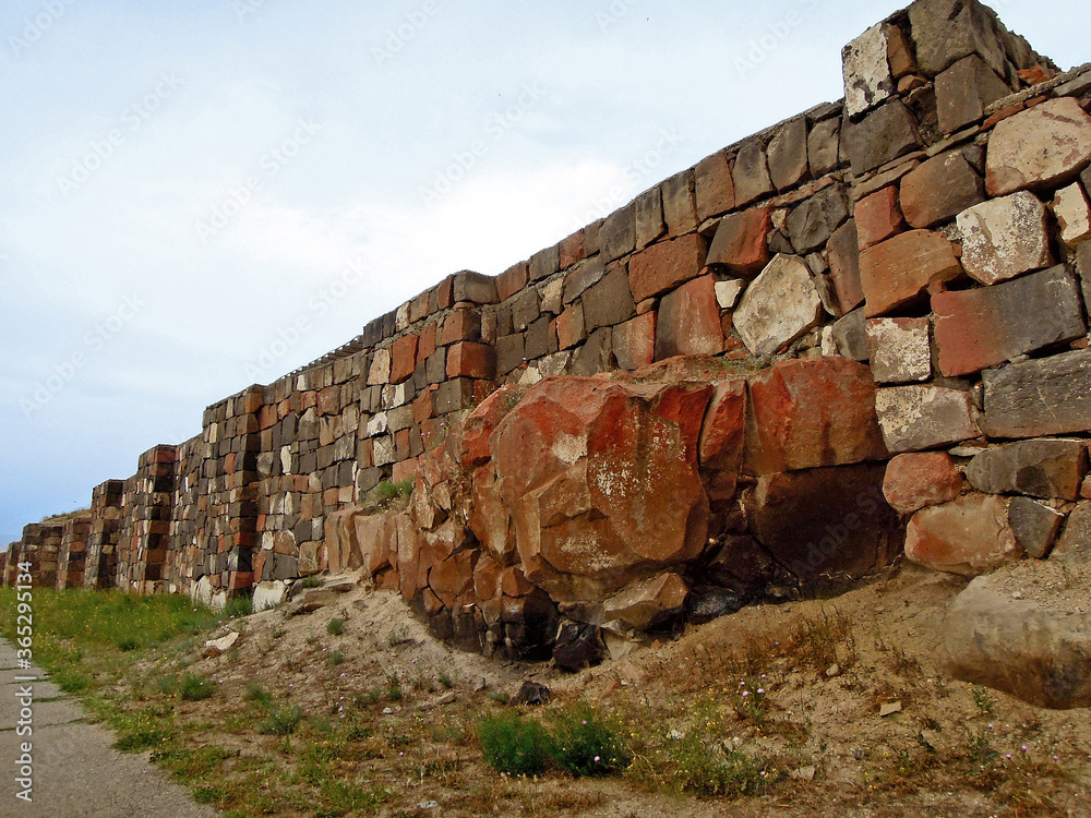 Foto de Stock View on the huge stone block from the exterior walls of ...
