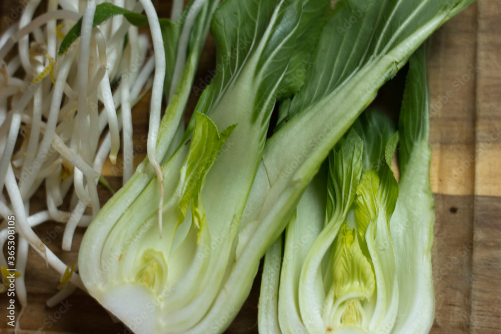 Bok choy vegetable sliced in halves with mung bean sprout Stock Photo ...