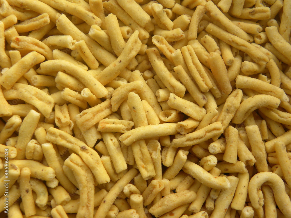 Yellow color fried Ratlami sev spicy Indian snack made from chickpea ...