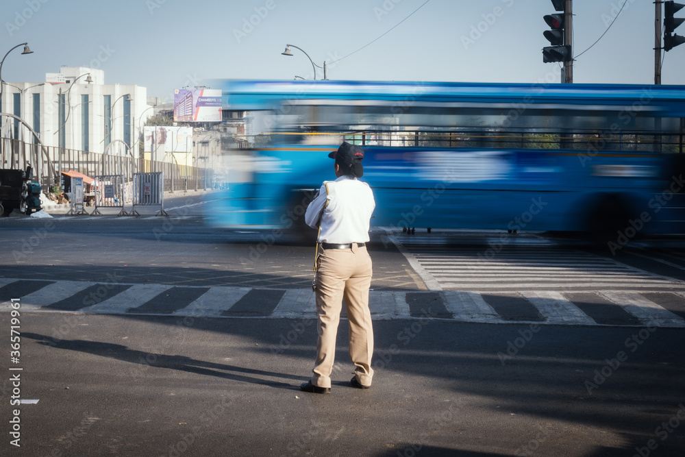 A female traffic officer controlling traffic on a busy road Stock Photo ...