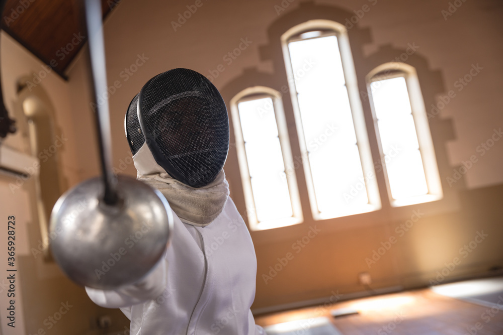 Female fencer practicing fencing Stock Photo | Adobe Stock