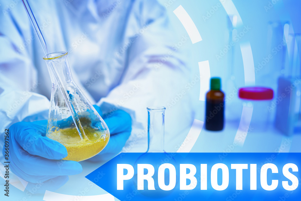 Probiotics. Lab technician holds flask with probiotics. Developing ...