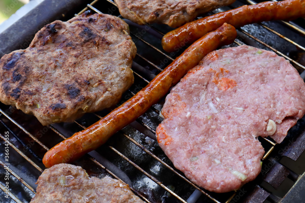 Traditional serbian barbecue (rostilj) homemade sausages and burgers ...