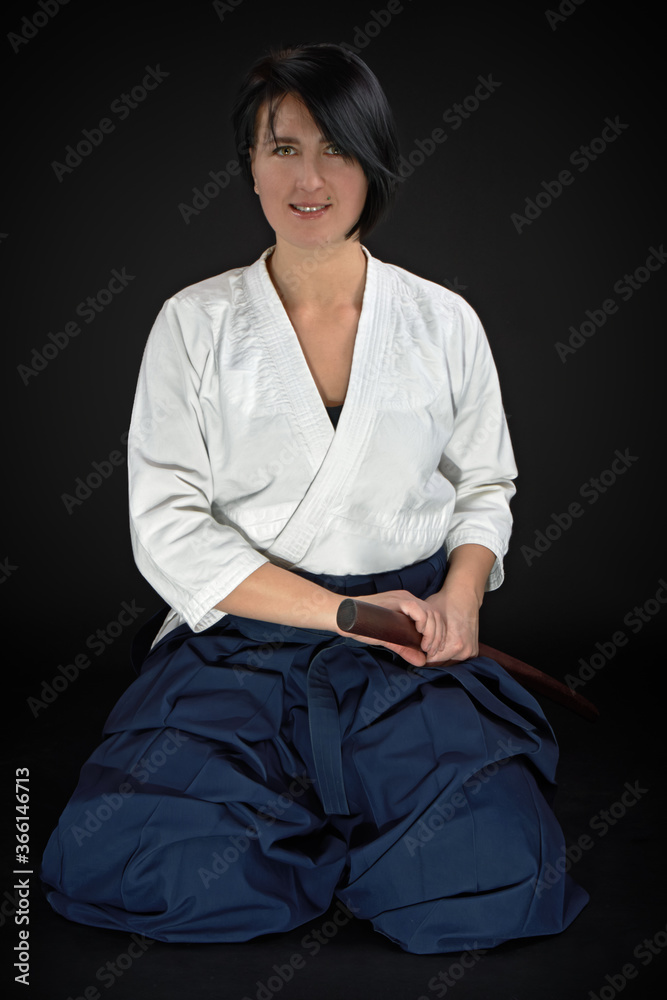 Aikido master woman in traditional samurai hakama kimono. learning ...