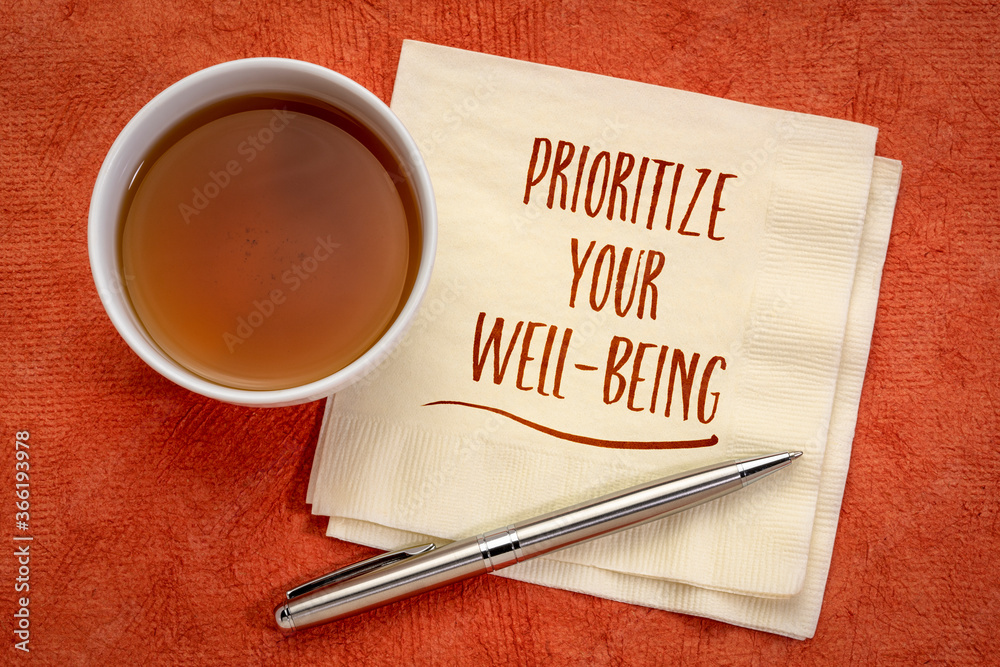 prioritize your well-being inspirational note - handwriting on a napkin ...