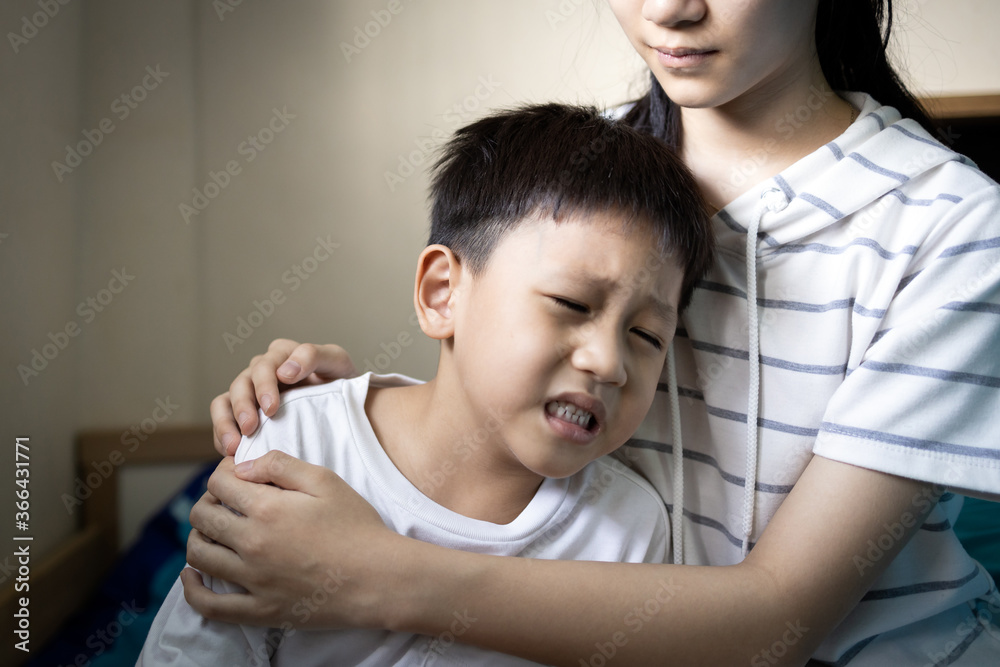 Asian big sister was embracing,comforting little brother,give advice ...