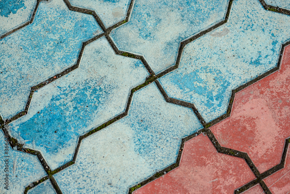 Streetlights and texture of different colored patterned paving slabs on ...