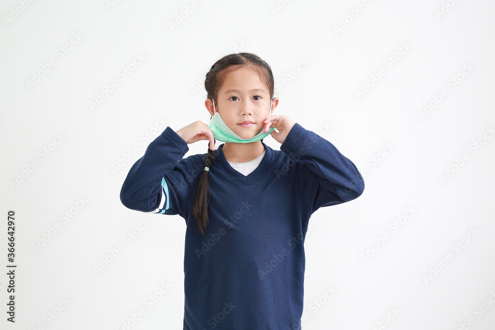 Portrait asian little kid girl wearing medical face mask slung on her ...