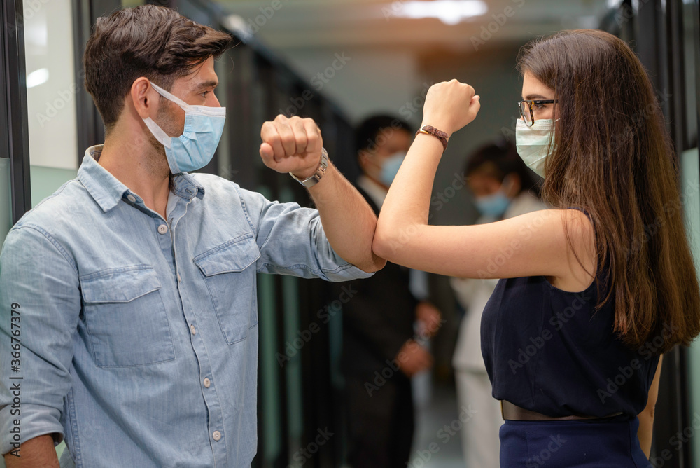 Business people greeting by use elbows bump instead handshake at ...