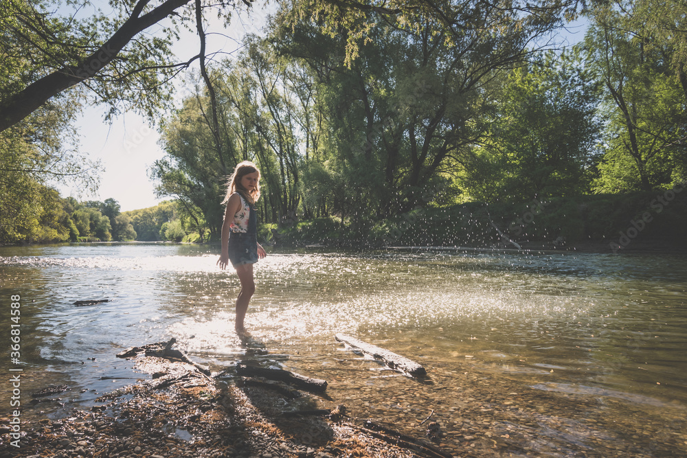 splashing water in river Danube bay in beautiful scenic green nature ...