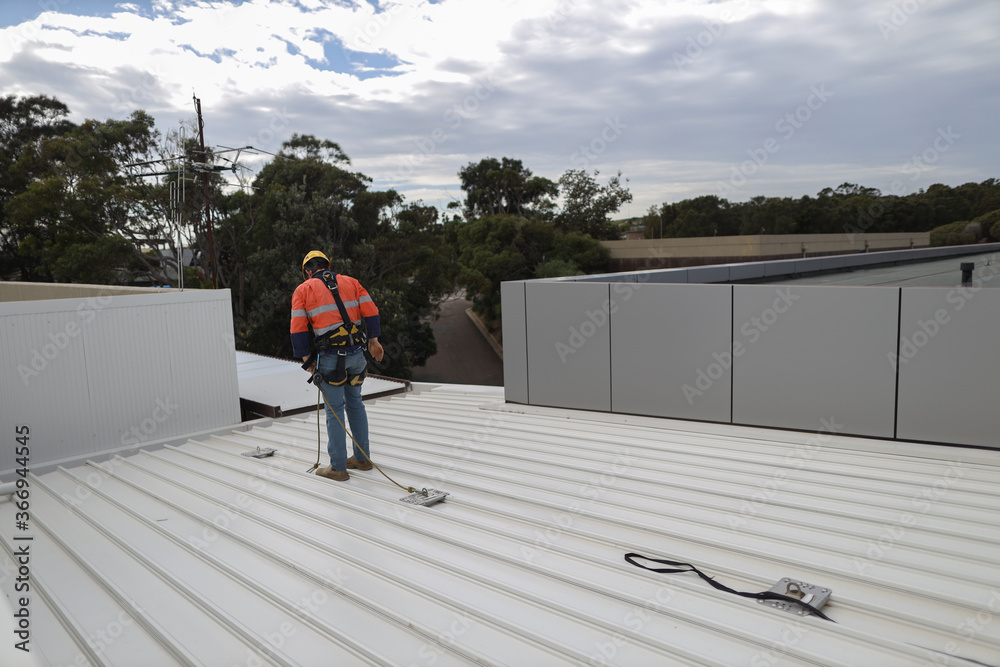Trained competent industrial construction worker wearing safety helmet ...