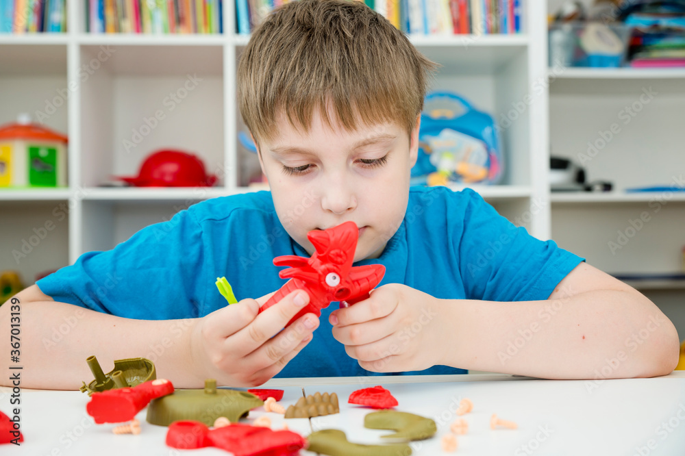 Dinosaur constructor made of plastic parts. Fine motor skills ...