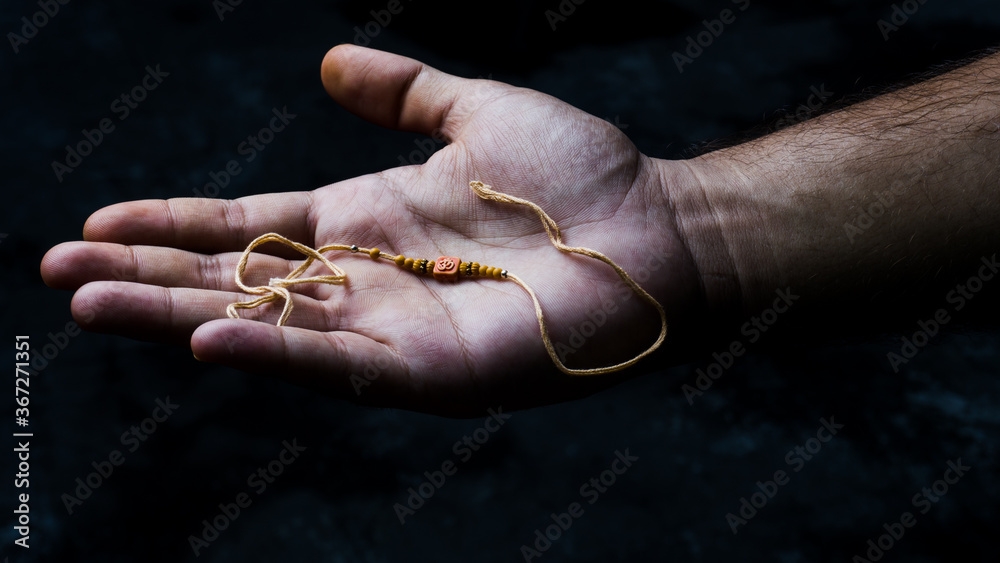 Rakhi in the hand for raksha bandhan. Rakhi also called as rakhdi ...